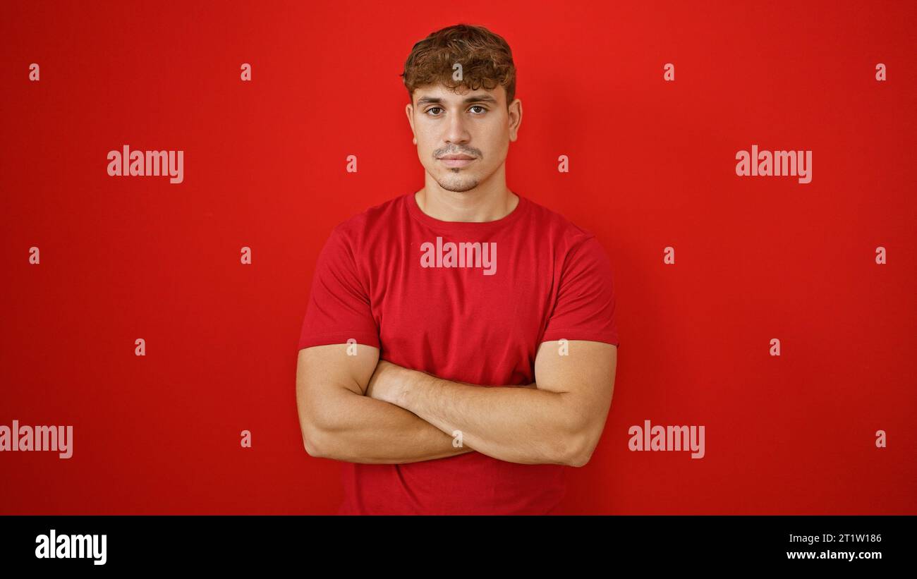 Attractive young hispanic man oozing coolness, standing relaxed yet ...