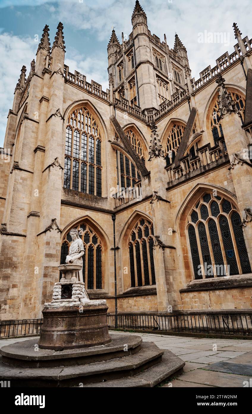 View of statuette and part of Bath Abbey. The abbey is constructed of ...