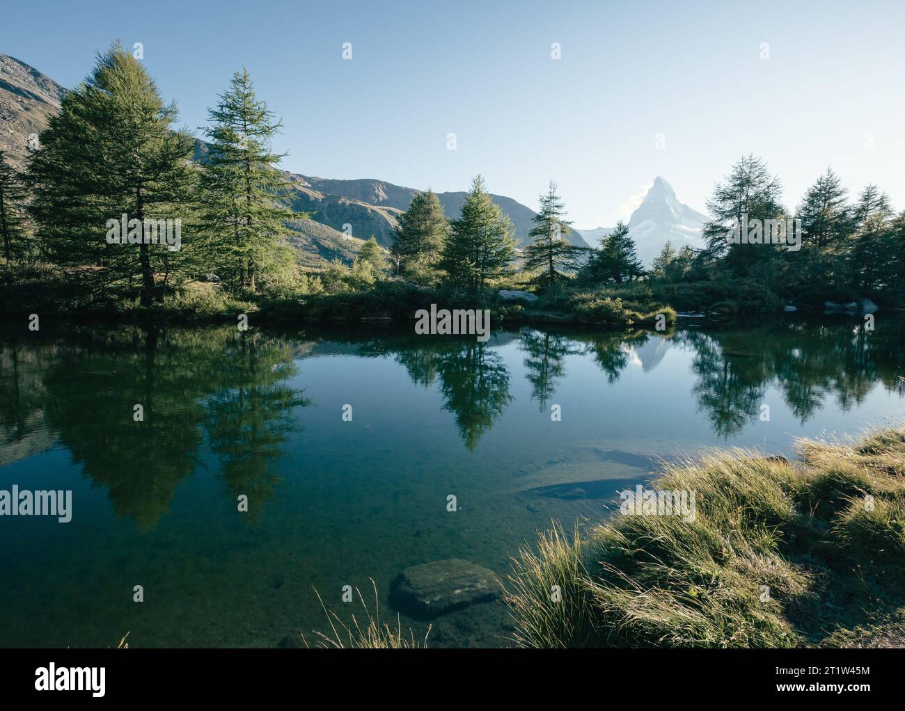 Scenic surroundings with famous peak Matterhorn in alpine valley ...