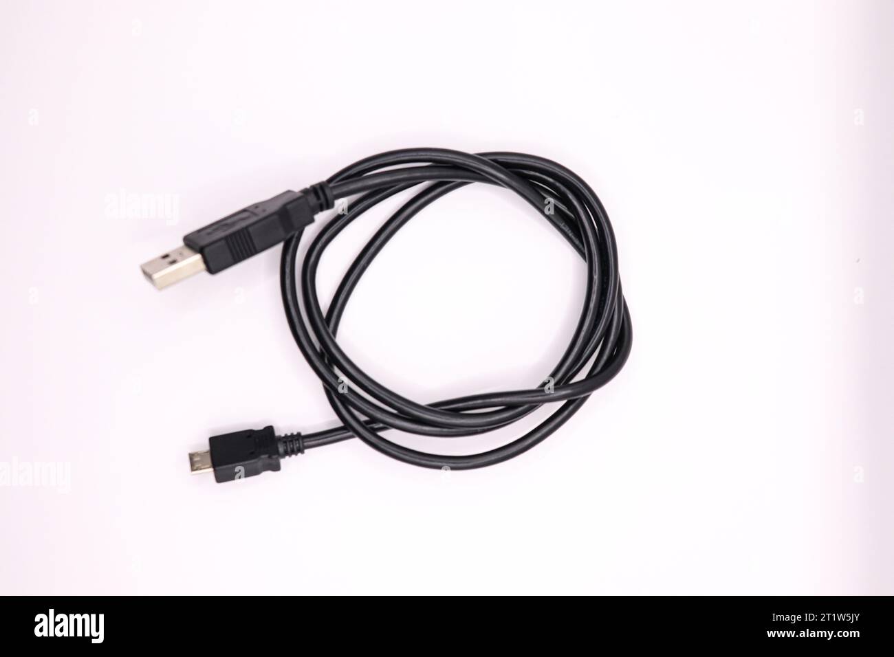 A view of a charging cable on white background Stock Photo - Alamy
