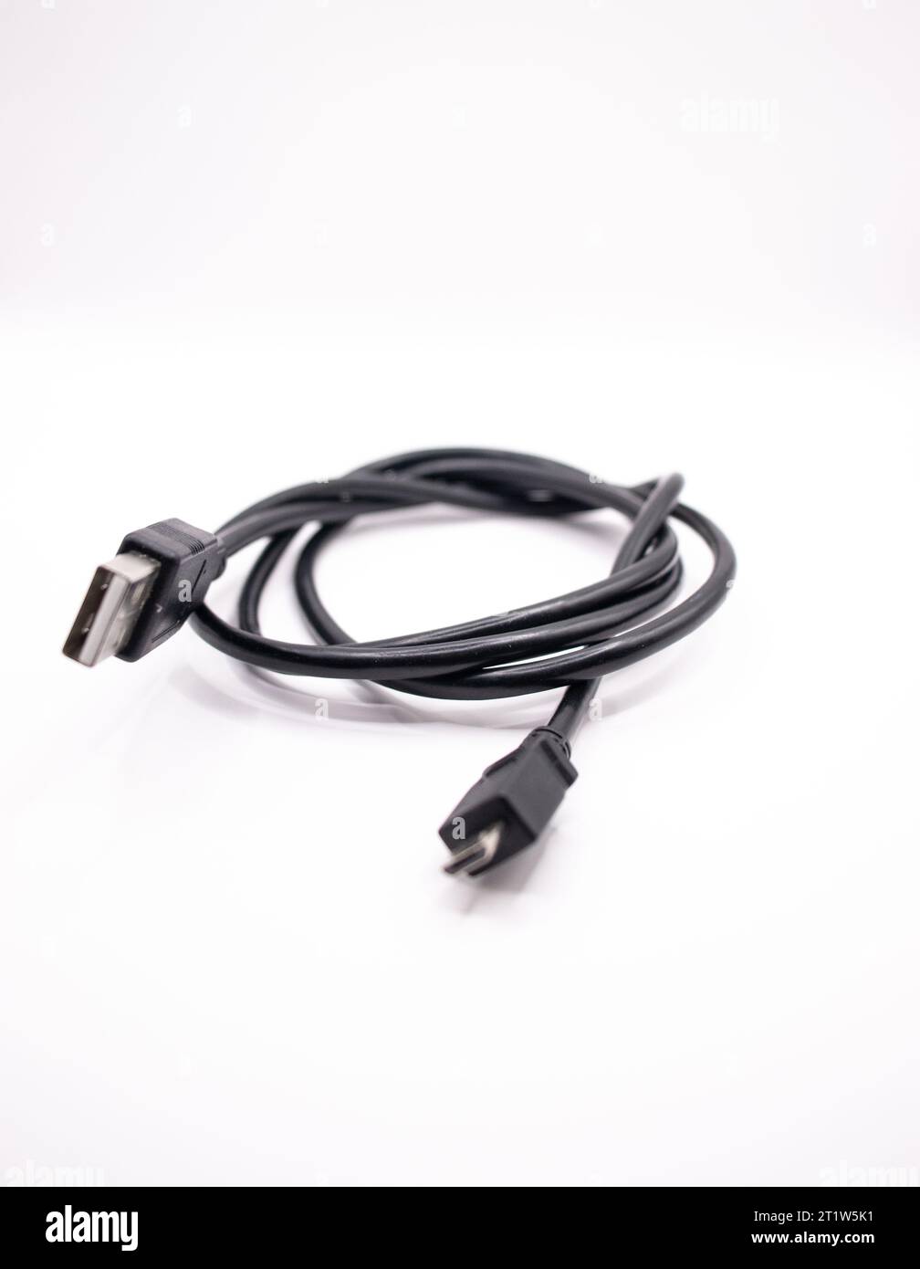 A view of a charging cable on white background Stock Photo - Alamy