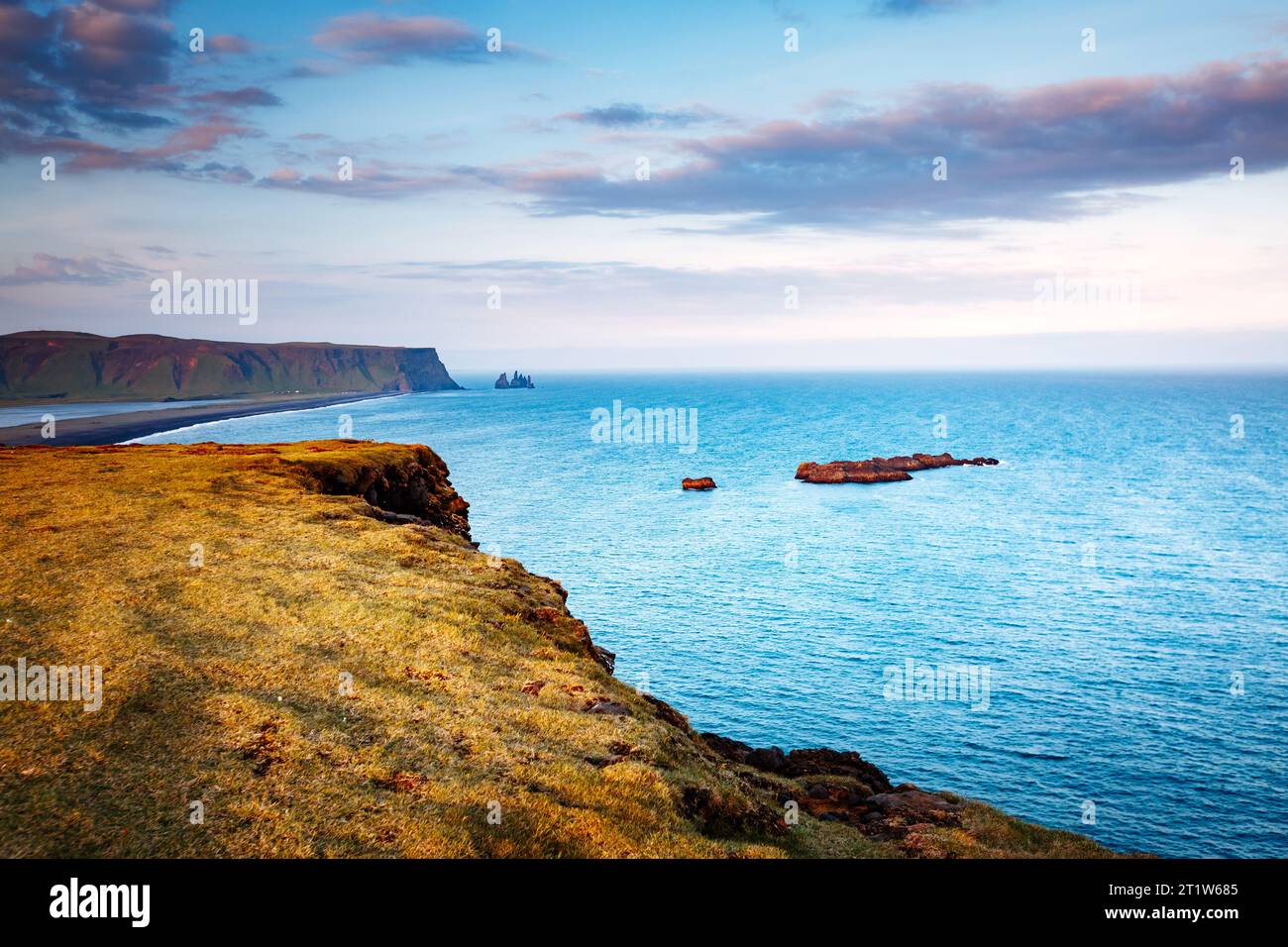 Great view on Kirkjufjara beach and sunny hills. Popular tourist ...