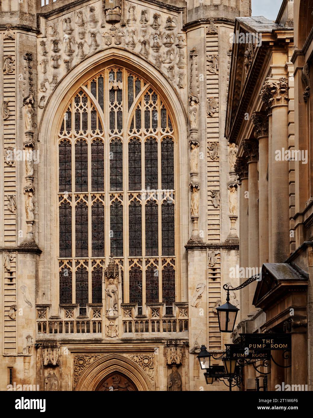 Stained glass window and exterior of the west face of the abbey, next ...