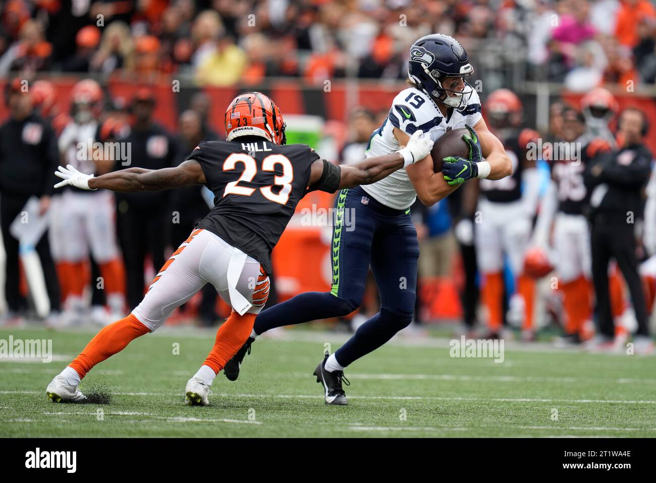 Seattle Seahawks' Jake Bobo (19) runs past Cincinnati Bengals' Dax Hill ...