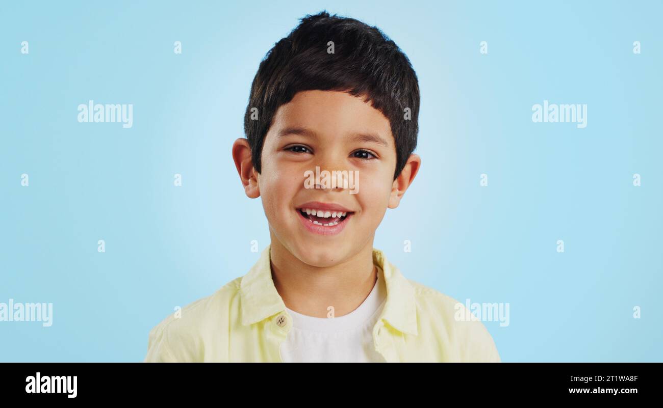 Face, boy child and smile in studio for wellness and confidence on a ...