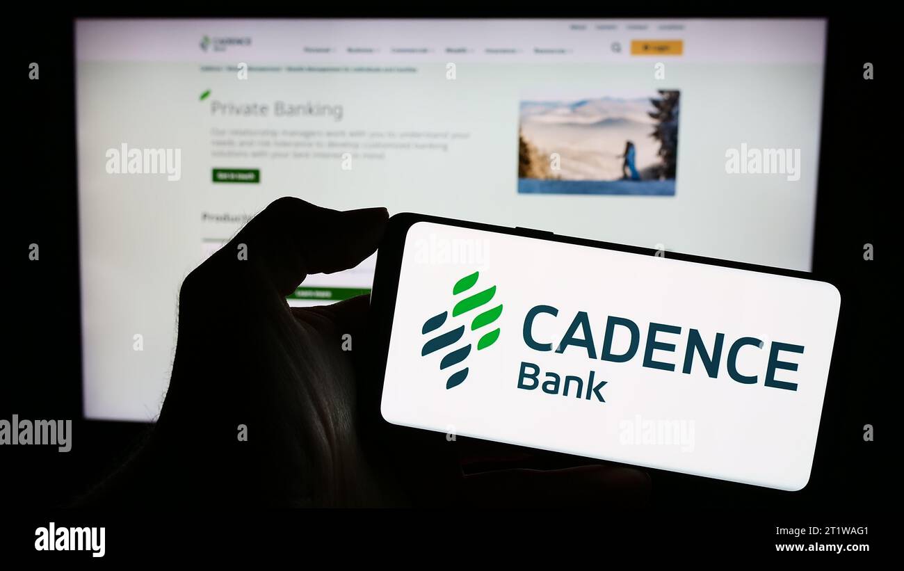 Person holding cellphone with logo of US financial services company ...