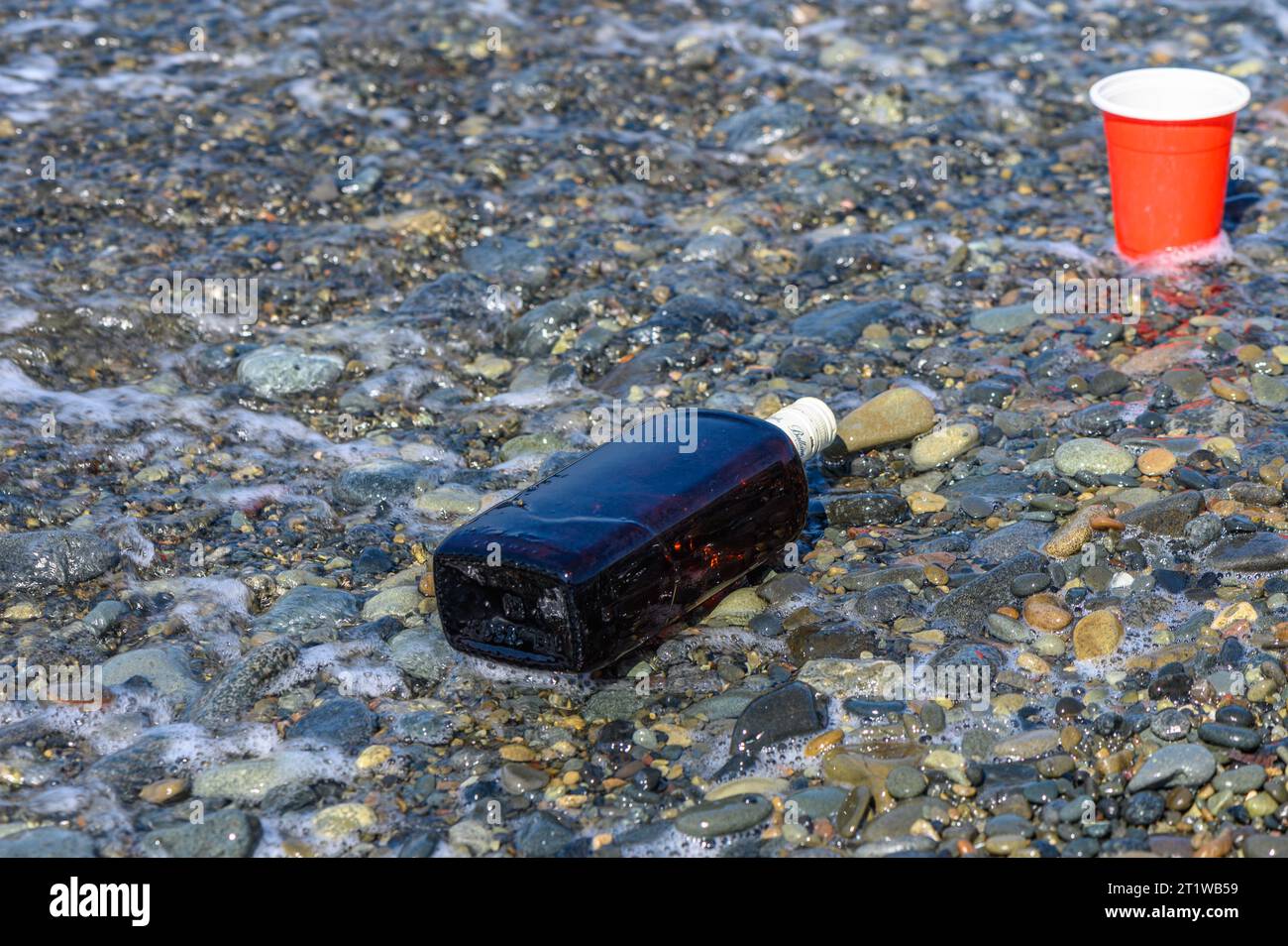 a bottle thrown into the sea and floating on the beach 2 Stock Photo ...