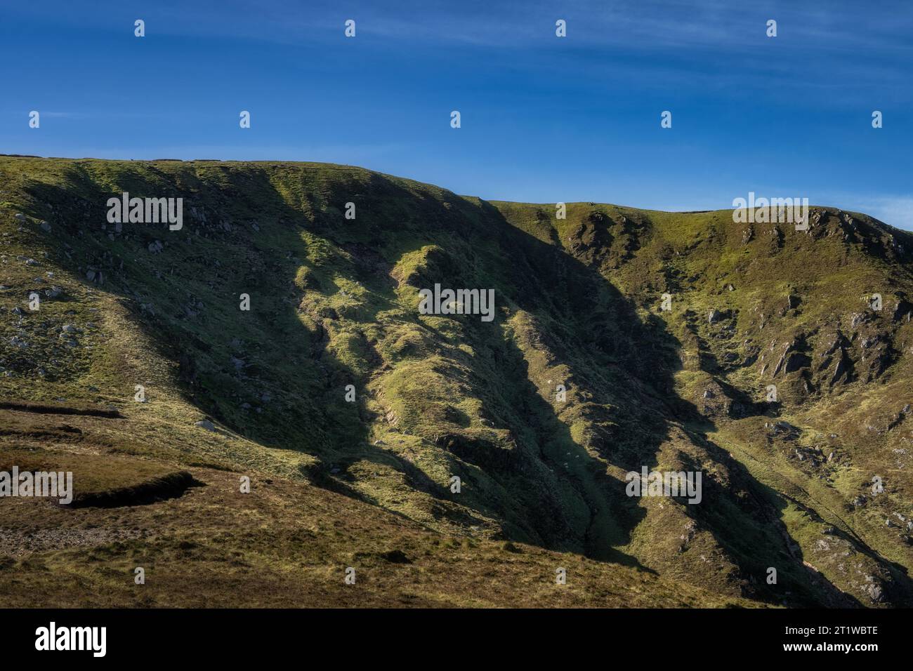 Hillside of Tonelagee Mountain with deep furrows, beautifully accented ...