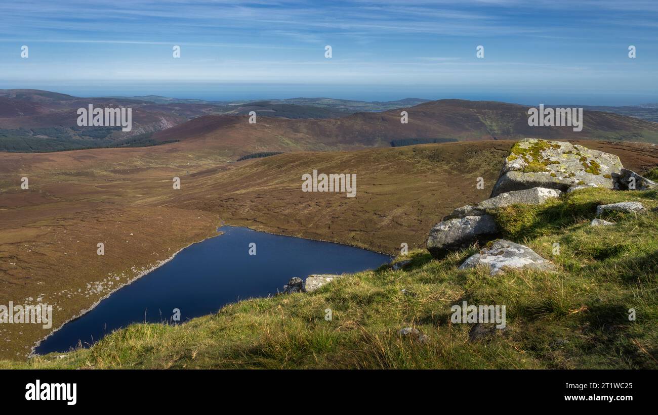Stack of large rocks on a hillside of Tonelagee Mountain with a view on ...