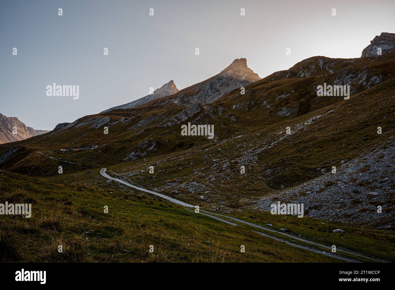 Landscape of the mountains, sky, forest and trail in autumn. Liddes ...