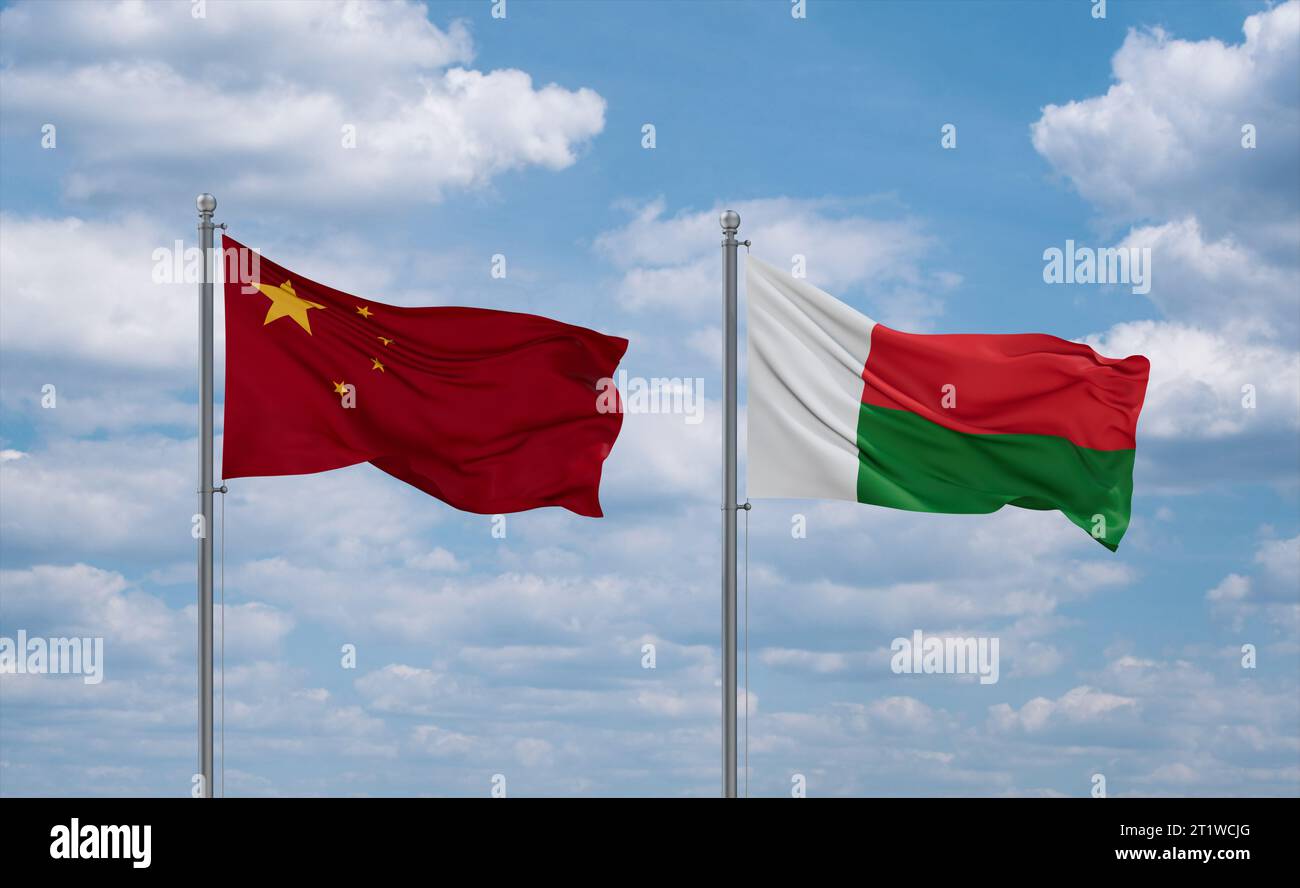 Madagascar and China flags waving together on blue cloudy sky, two country relationship concept ...