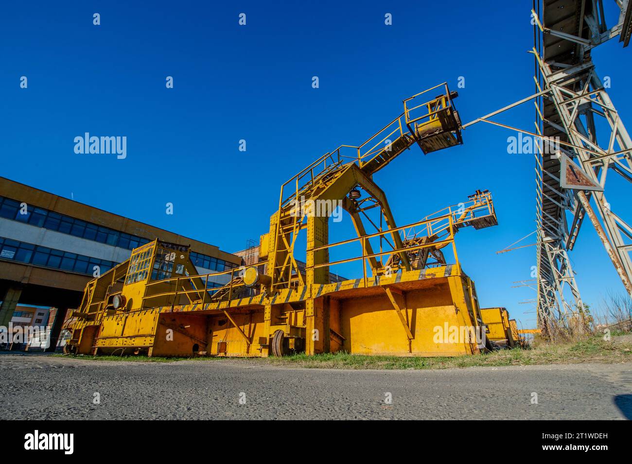 Inside the ruins of an old factory in Romania of a Communist Era. Step ...