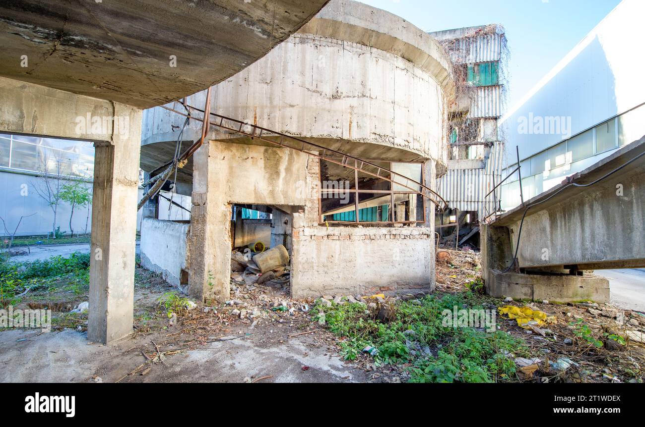 Inside the ruins of an old factory in Romania of a Communist Era. Step ...