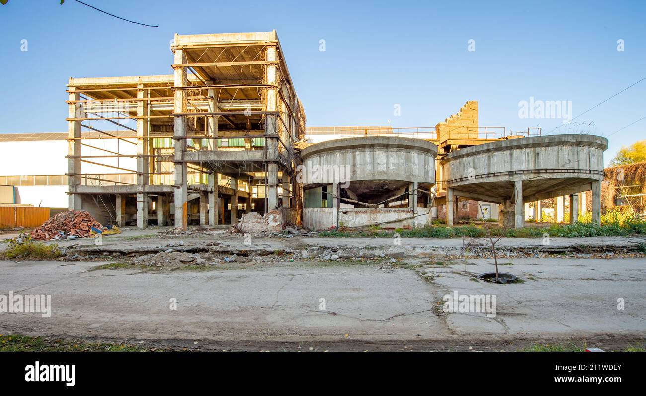 Inside the ruins of an old factory in Romania of a Communist Era. Step ...