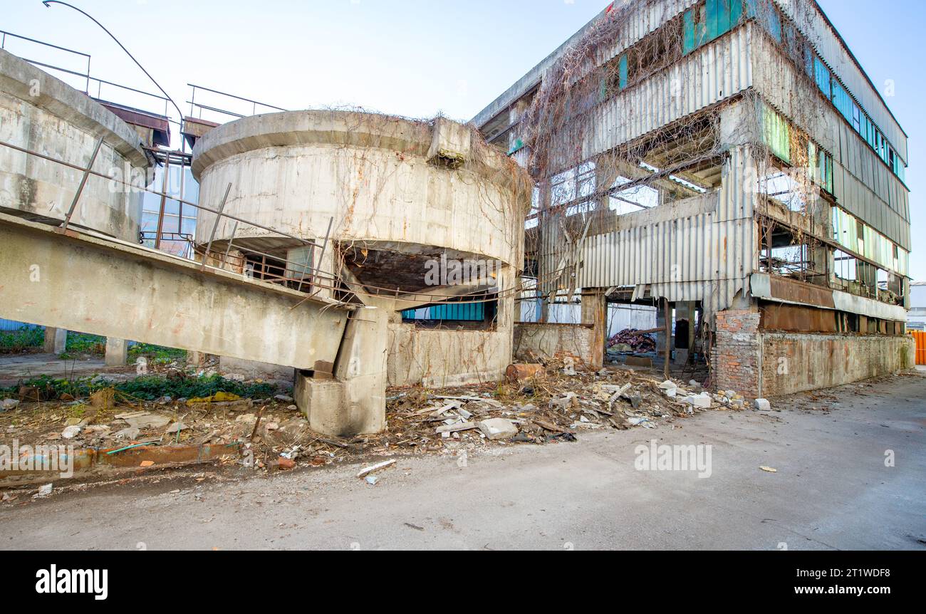 Inside the ruins of an old factory in Romania of a Communist Era. Step ...