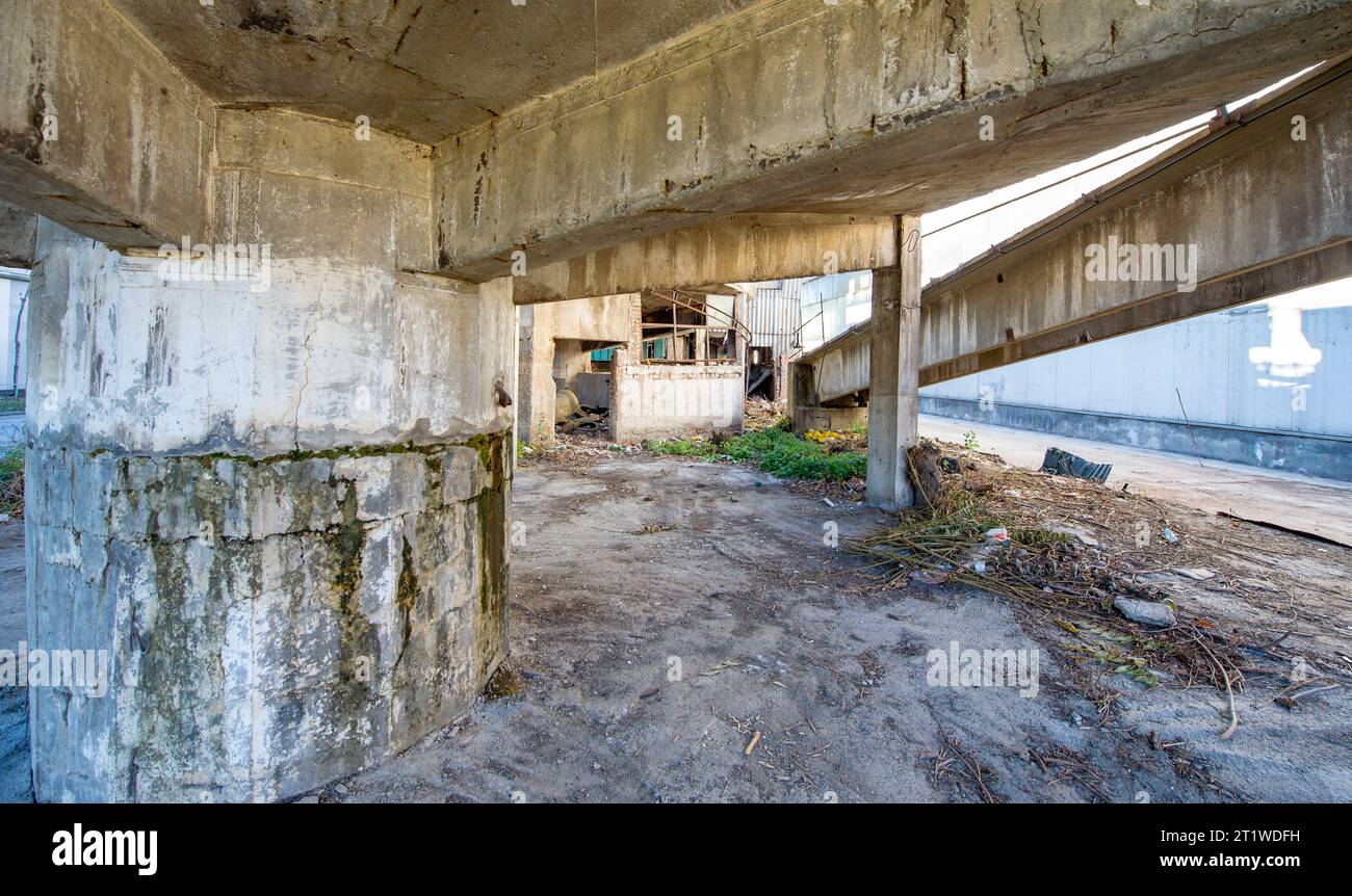 Inside the ruins of an old factory in Romania of a Communist Era. Step ...