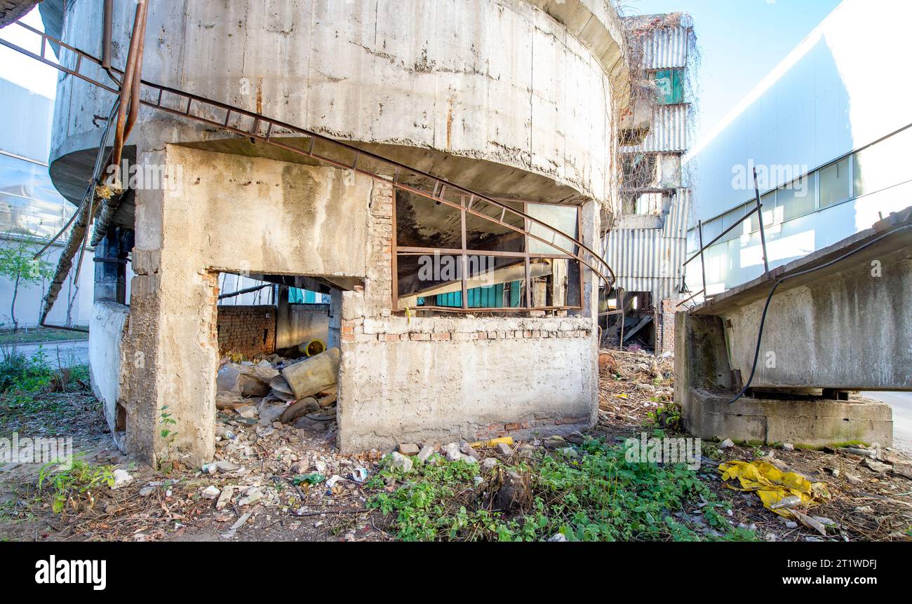 Inside the ruins of an old factory in Romania of a Communist Era. Step ...