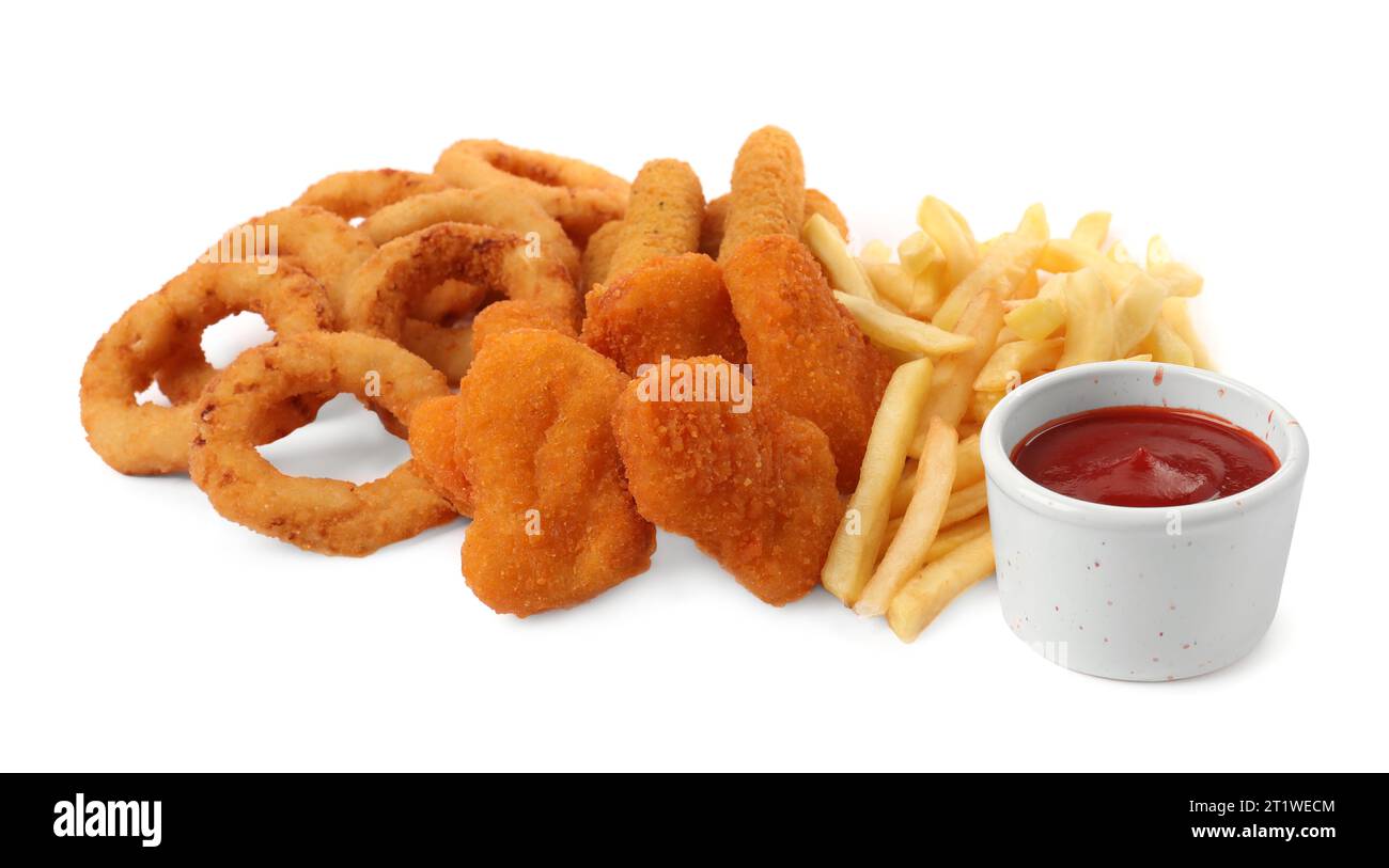 Different delicious fast food served with ketchup on white background ...