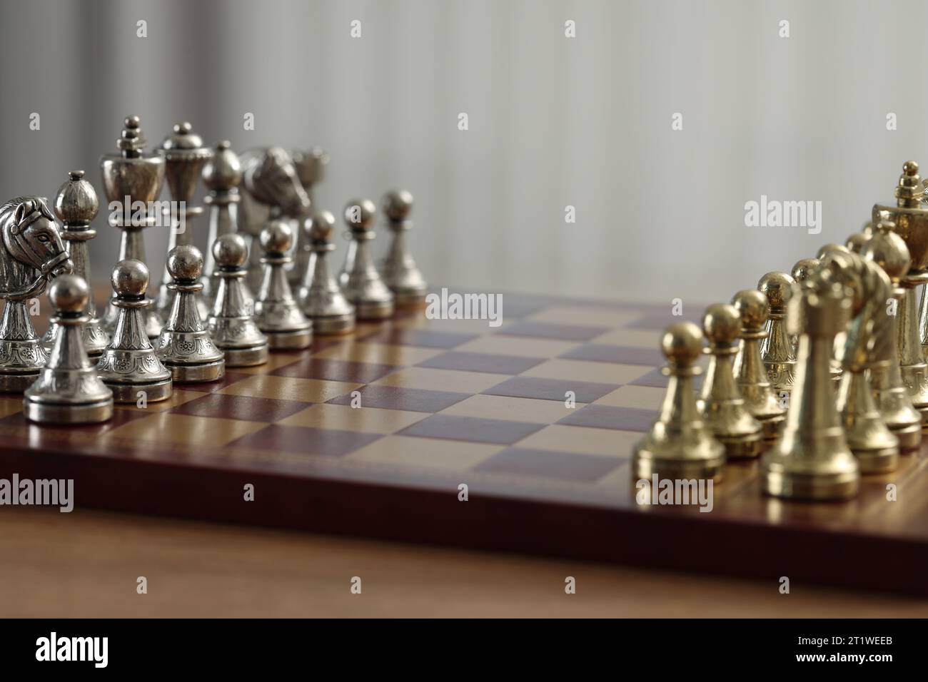 Set of chess pieces on checkerboard before game, selective focus. Space ...