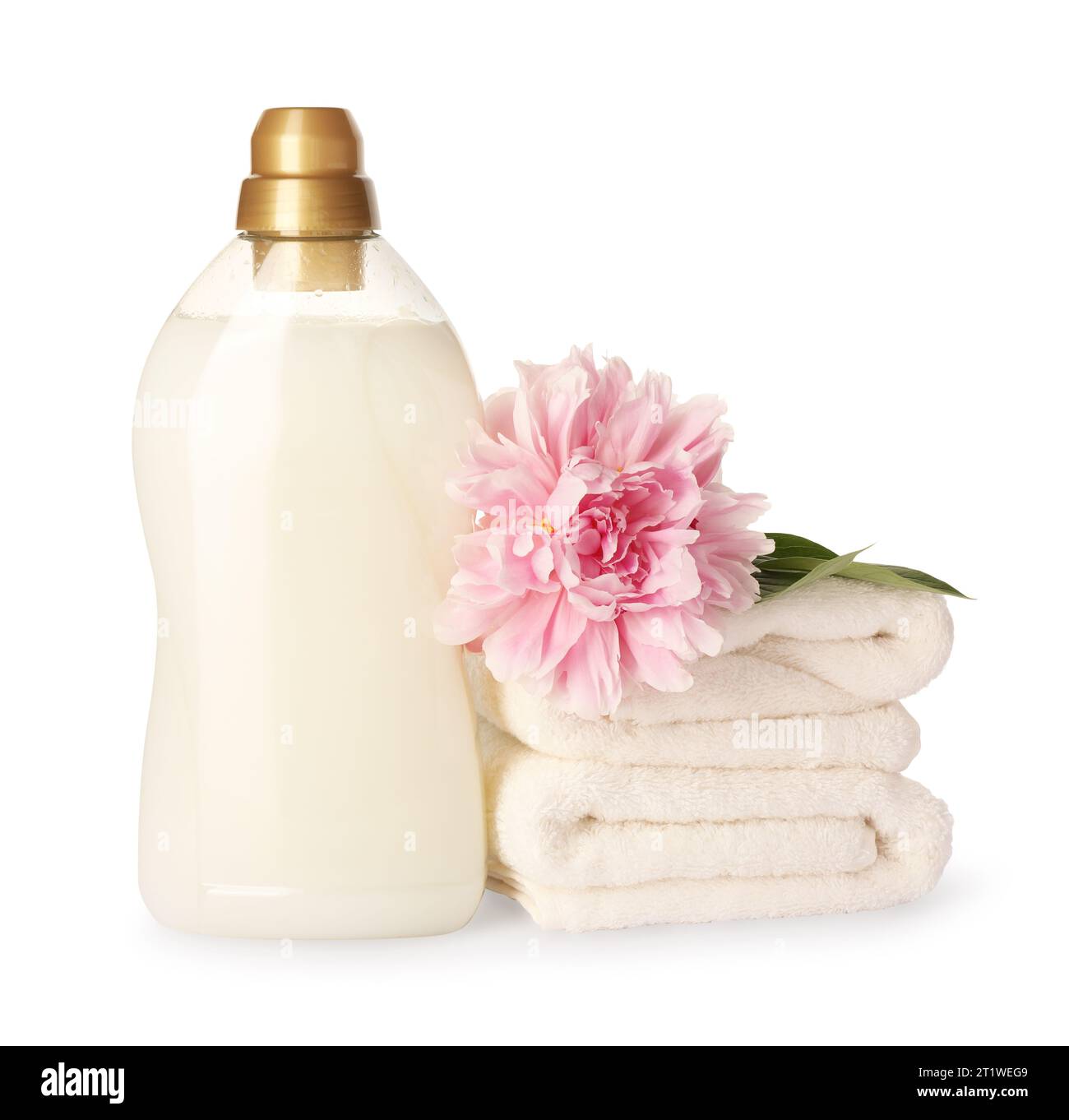 Bottle of fabric softener, stacked clean towels and beautiful flower ...