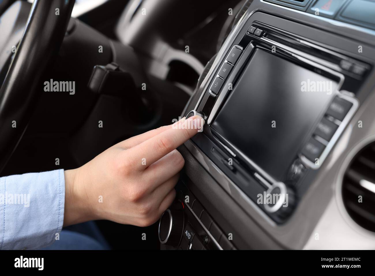 Woman radio volume control hi-res stock photography and images - Alamy