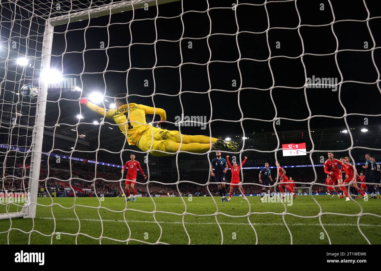 Croatia goalkeeper Dominik Livakovic makes a save from a free kick by ...