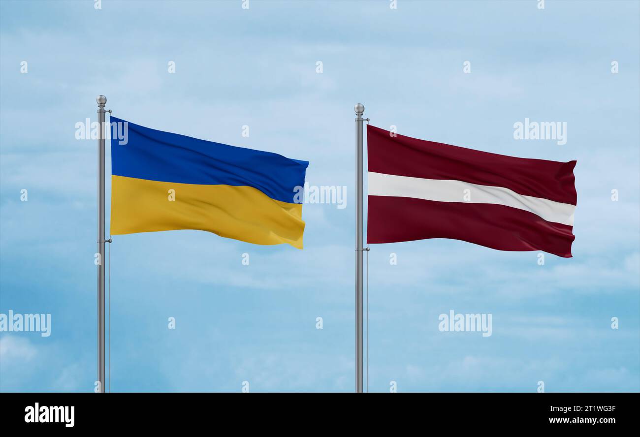 Latvia and Ukraine flags waving together in the wind on blue cloudy sky, two country ...