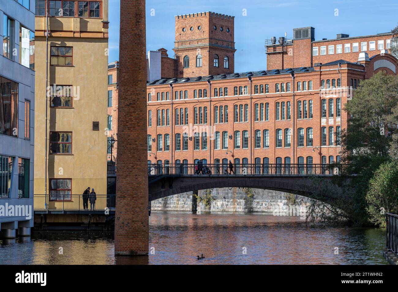 Motala river in the old industrial landscape during autumn. Norrköping ...