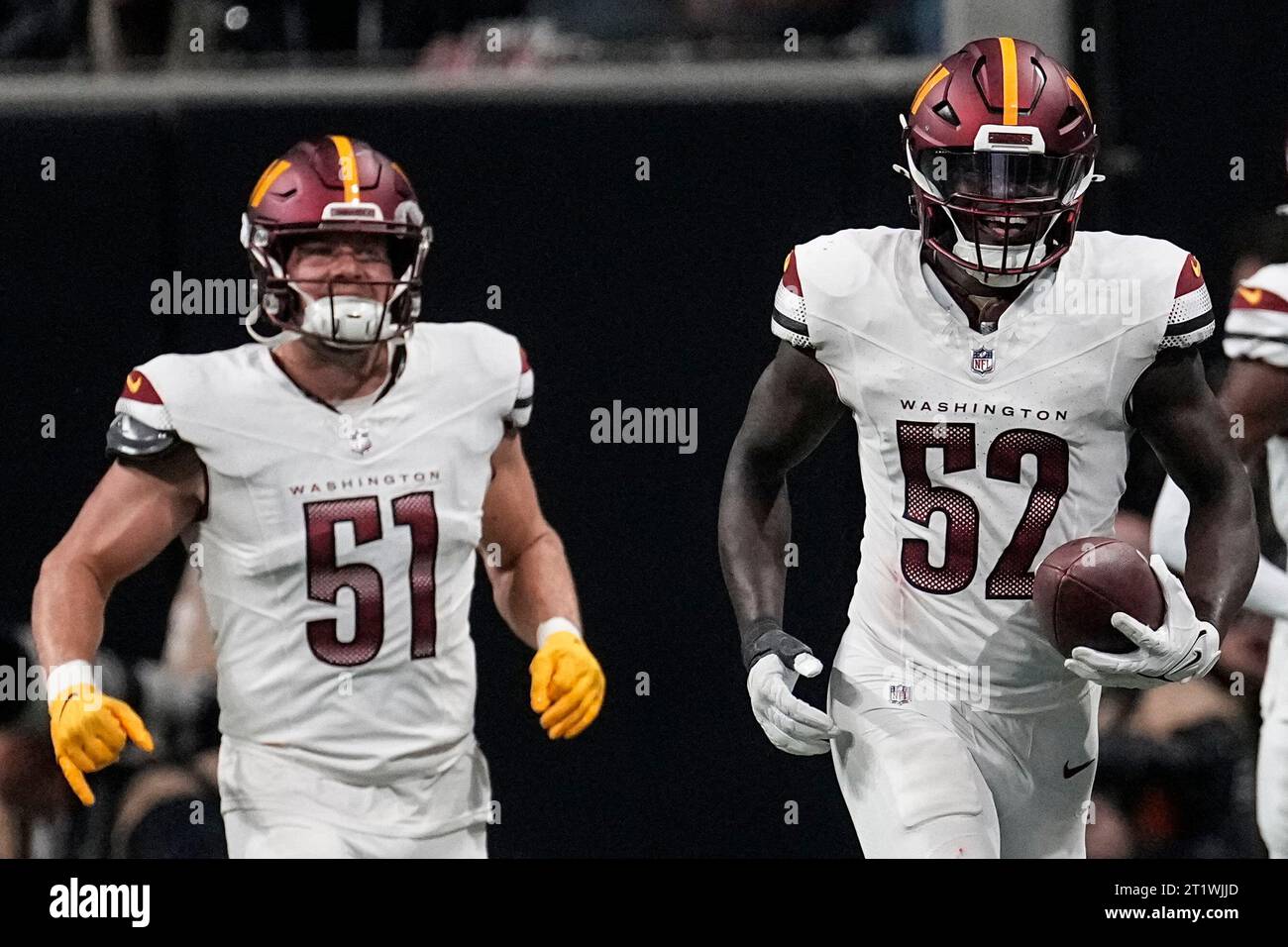 Washington Commanders linebacker Jamin Davis (52) runs toward the bench ...