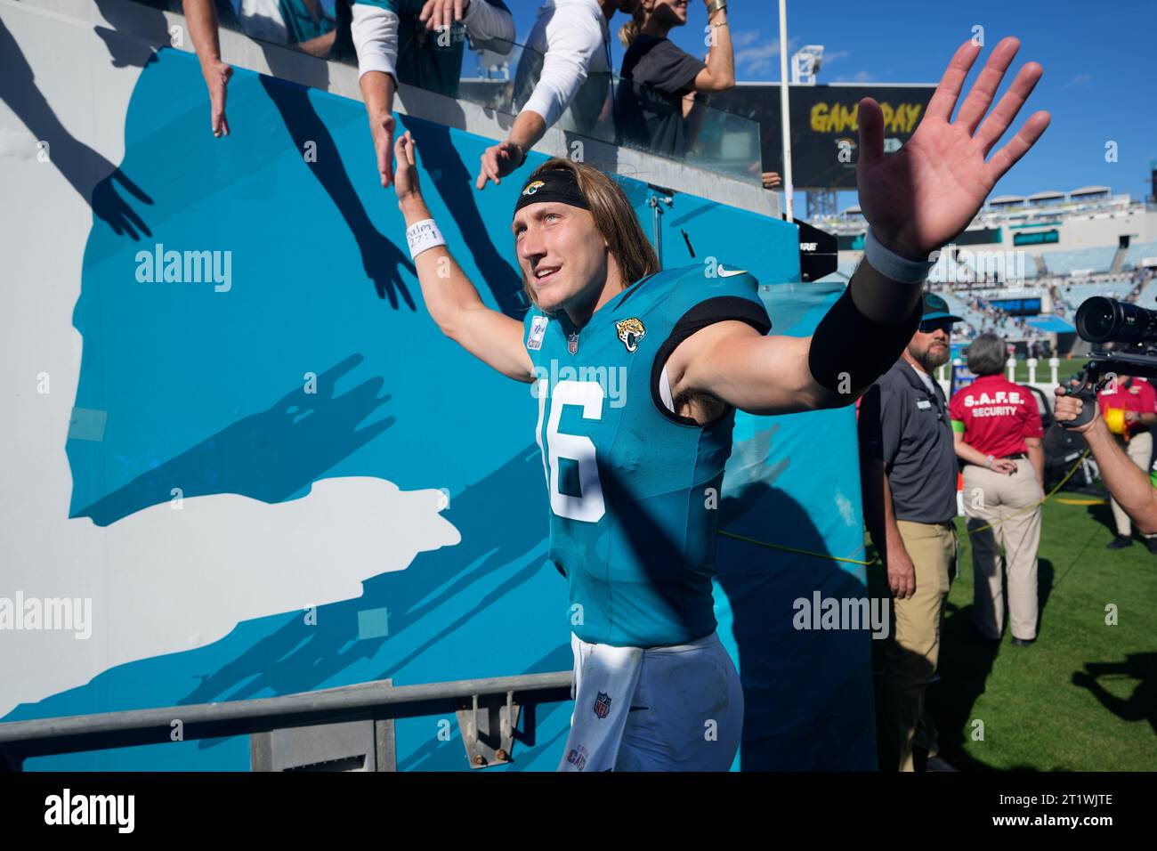 Jacksonville Jaguars quarterback Trevor Lawrence (16) waves to fans as ...