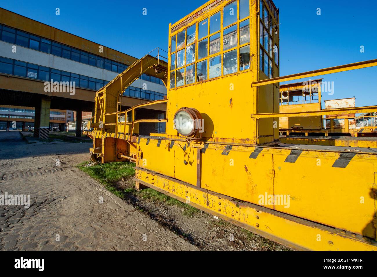 Inside the ruins of an old factory in Romania of a Communist Era. Step ...