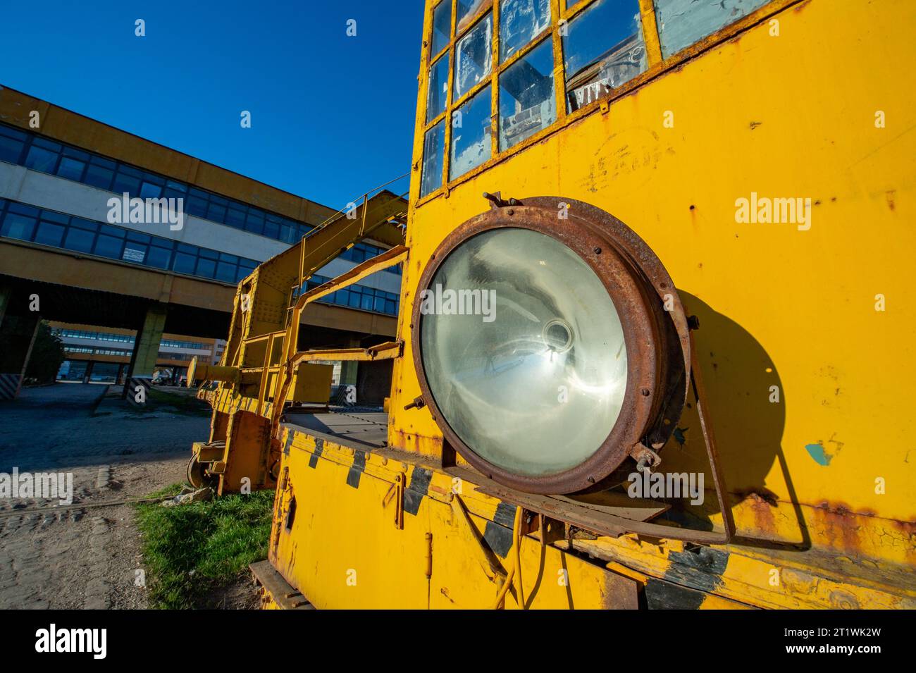 Inside the ruins of an old factory in Romania of a Communist Era. Step ...