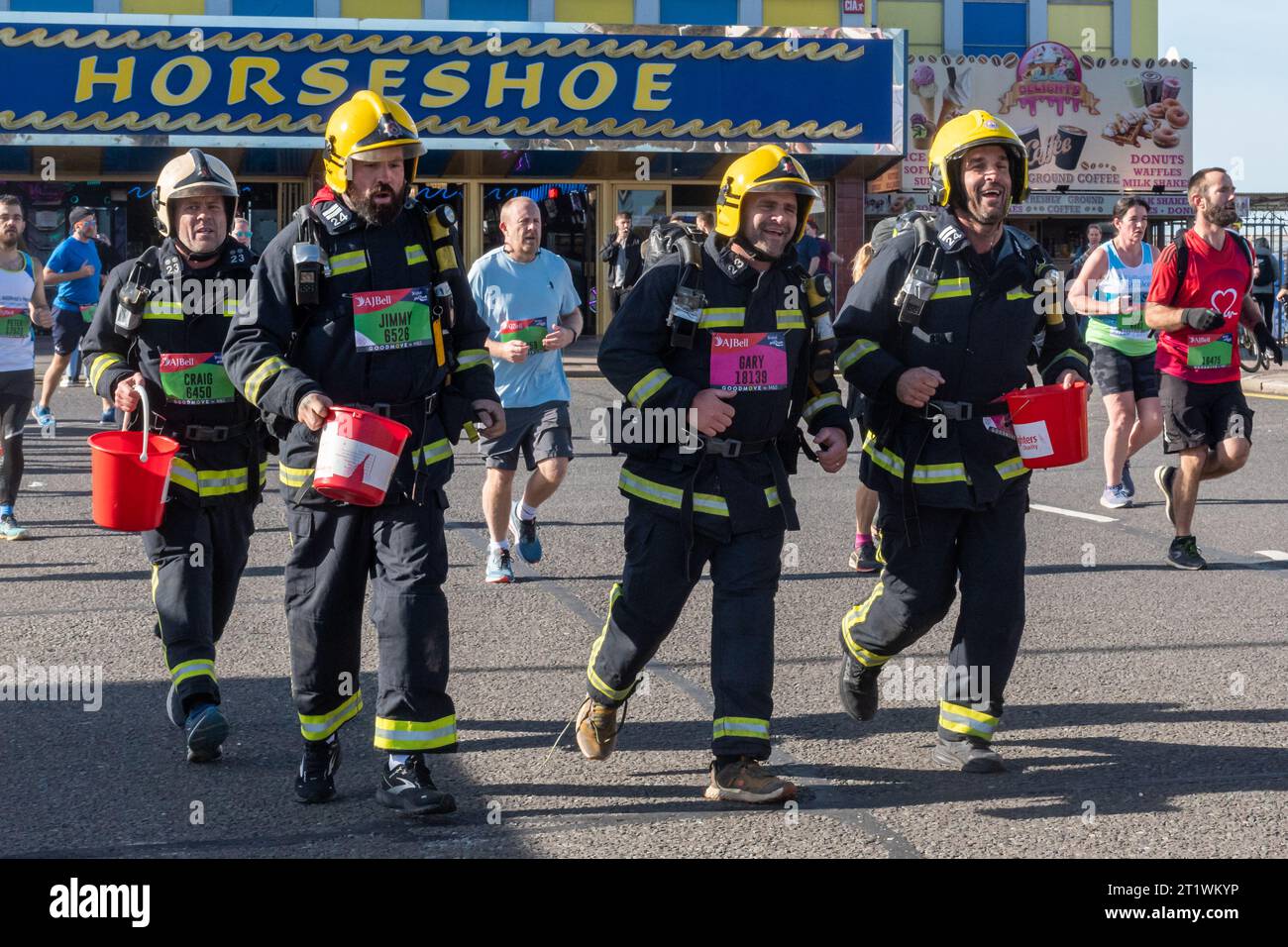 Fire fighters running in uniform hi-res stock photography and images ...