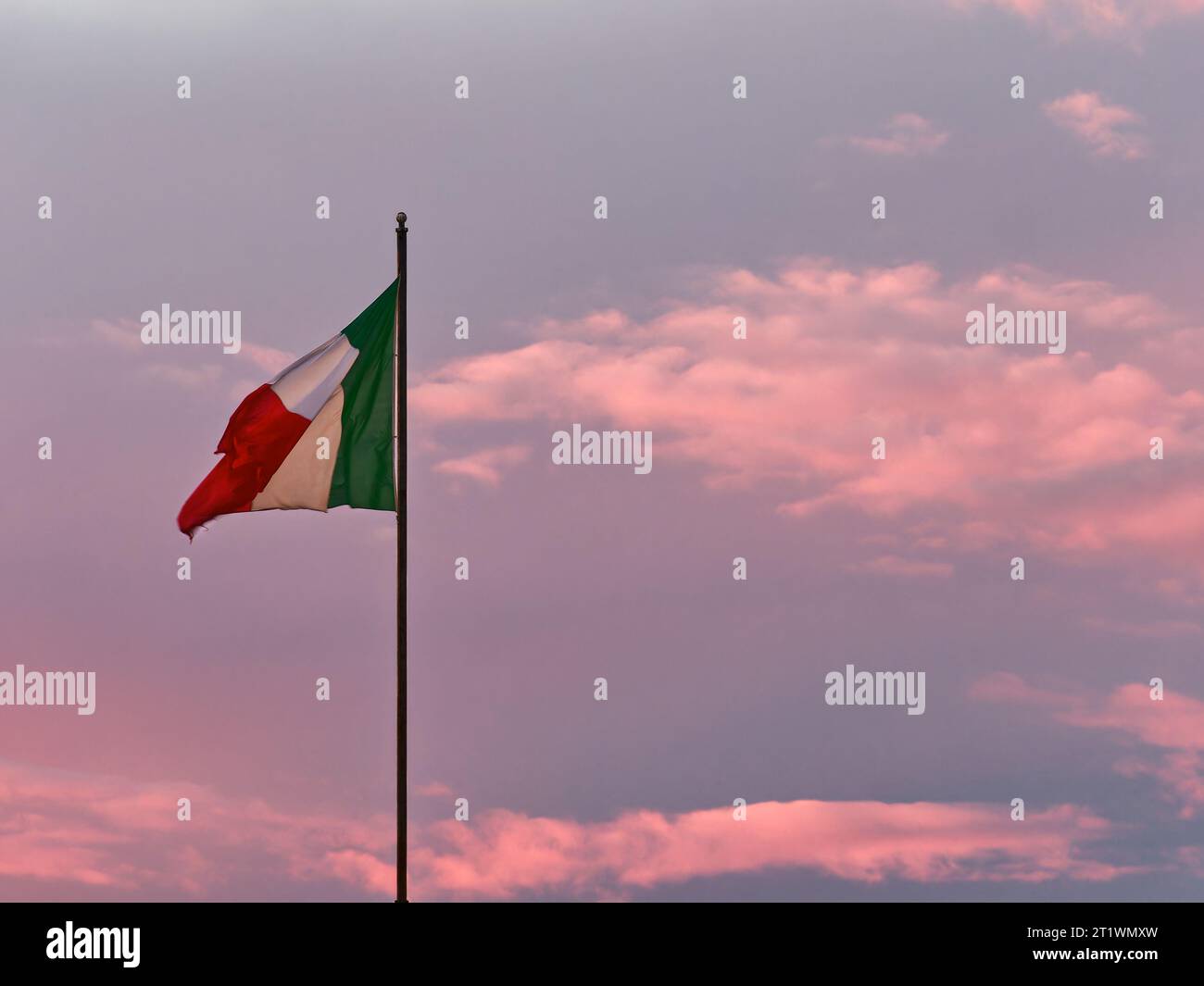Italian flag waving in sunset colors, Rome, Italy Stock Photo - Alamy