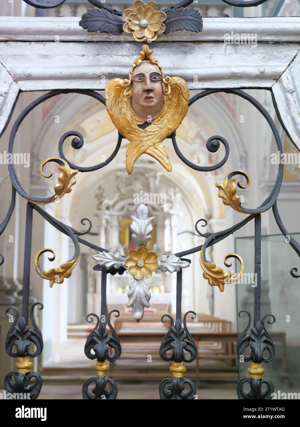 Miniature head in a baroque wrought iron grille in Schöntal monastery ...