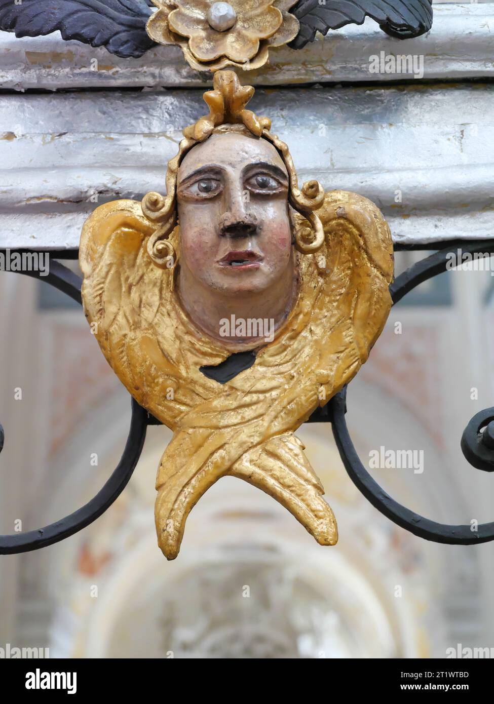 Miniature head in a baroque wrought iron grille in Schöntal monastery ...