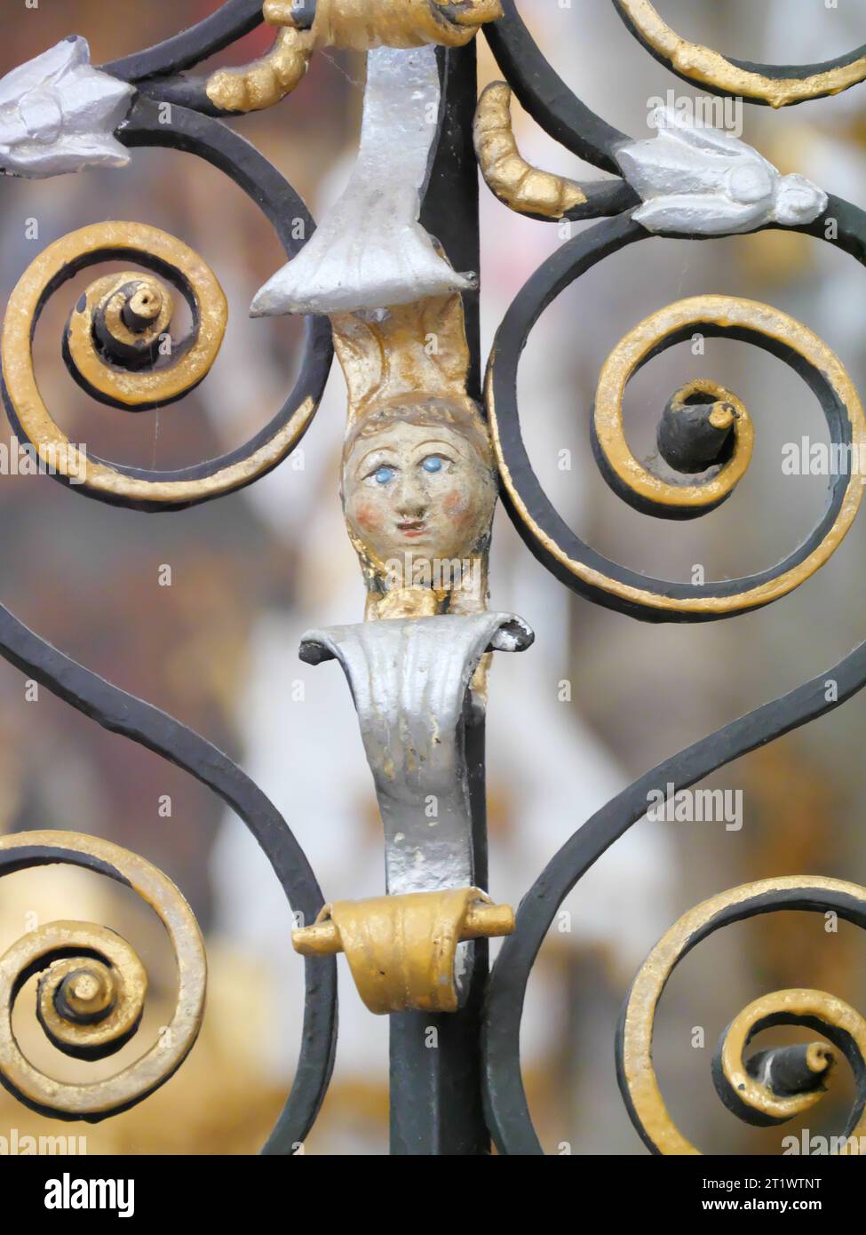Miniature head in a baroque wrought iron grille in Schöntal monastery ...