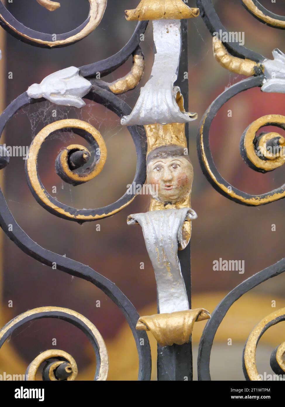 Miniature head in a baroque wrought iron grille in Schöntal monastery ...