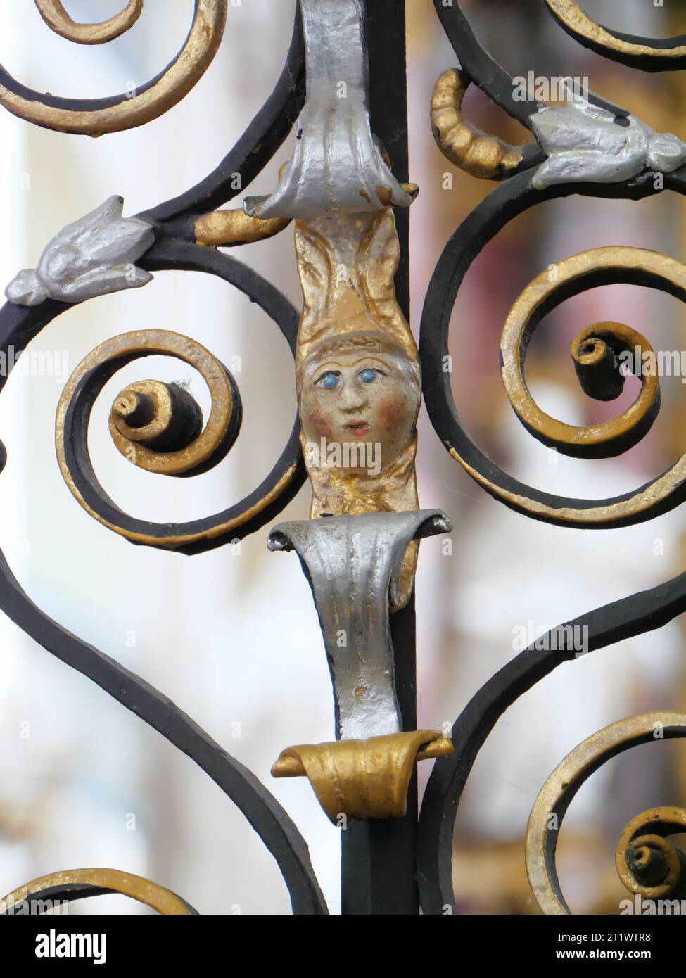 Miniature head in a baroque wrought iron grille in Schöntal monastery ...