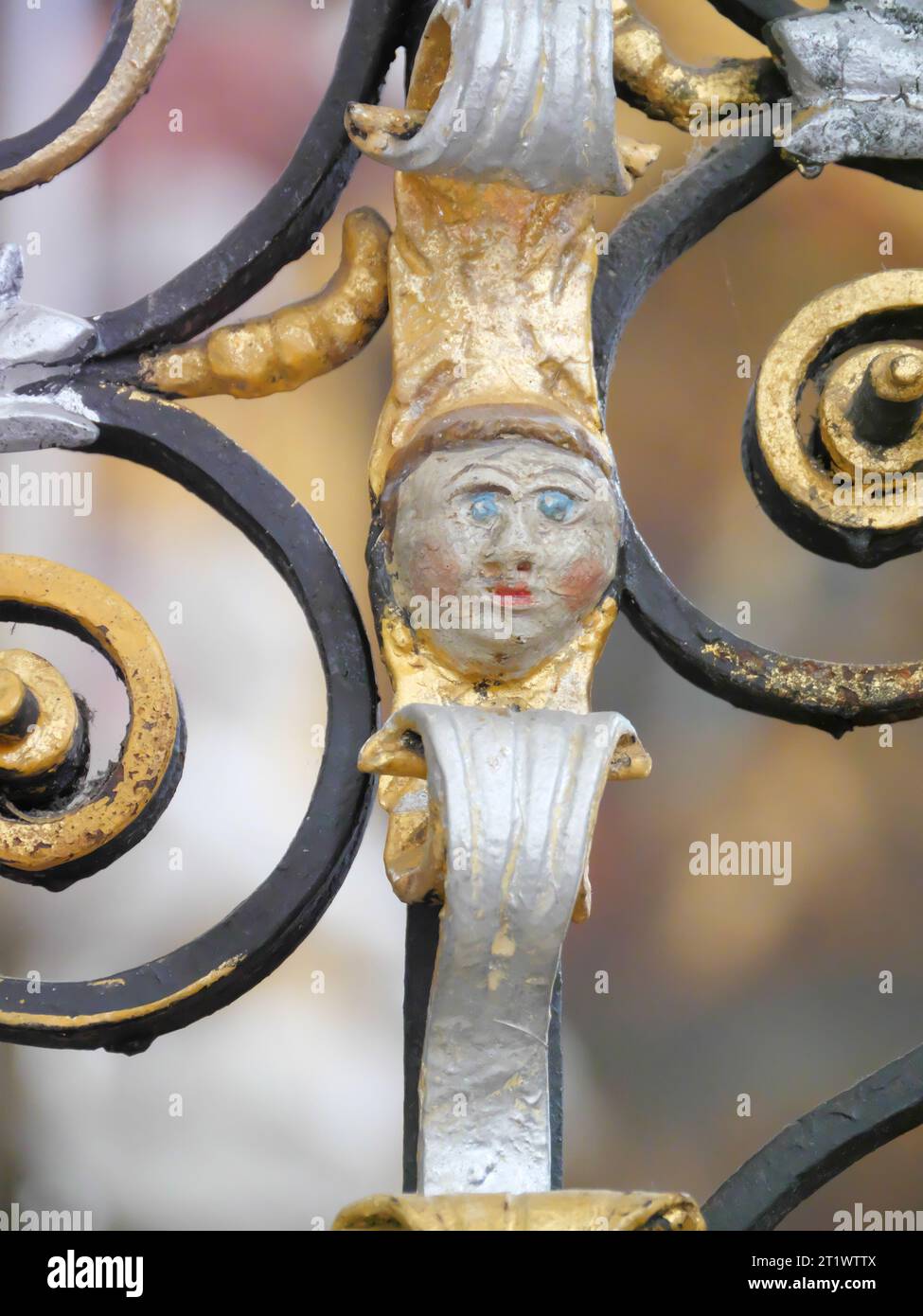 Miniature head in a baroque wrought iron grille in Schöntal monastery ...