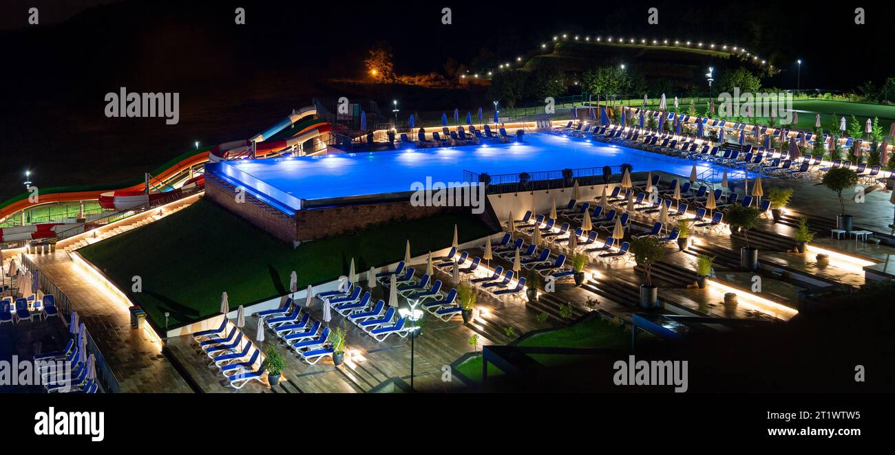 Night swimming pool of a luxury hotel with beautiful lighting without ...