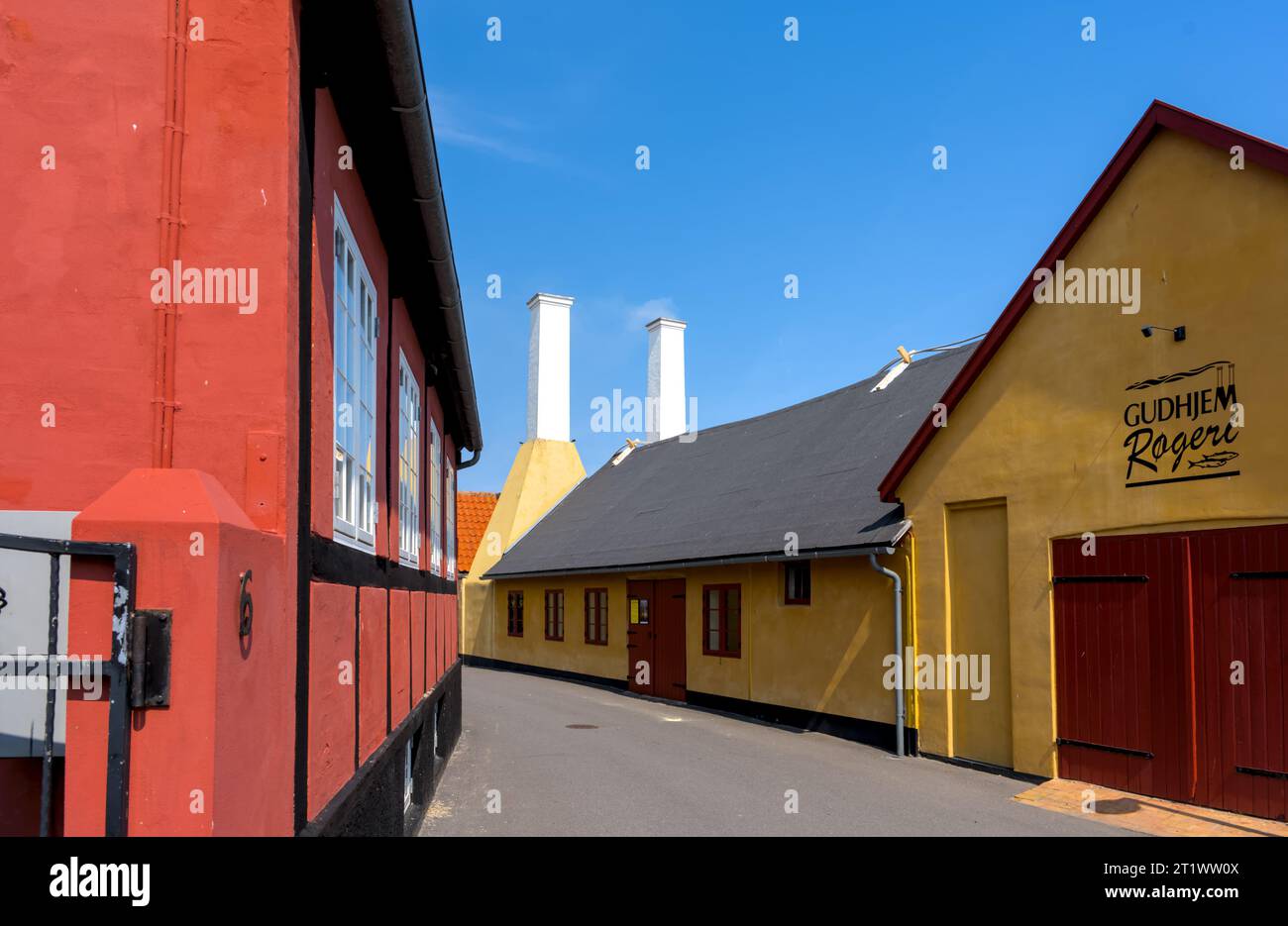 a traditional small,red,danish framehouse in summer in Bornholm with ...