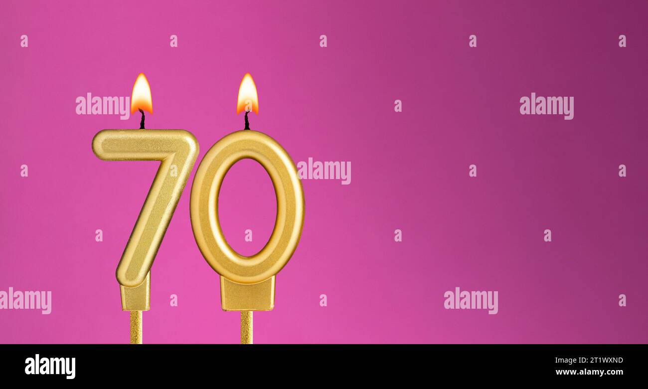 Birthday card with candle number 70 - purple background Stock Photo - Alamy