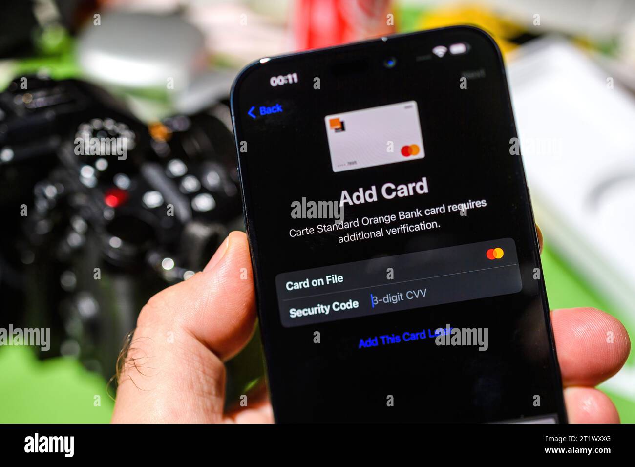 London, UK - Sep 28, 2023: A tilt-shift lens captures a hand holding ...
