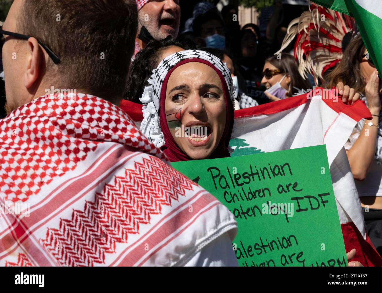 Austin, Texas, USA. 15th Oct, 2023. A woman shouts as 250 people rally ...