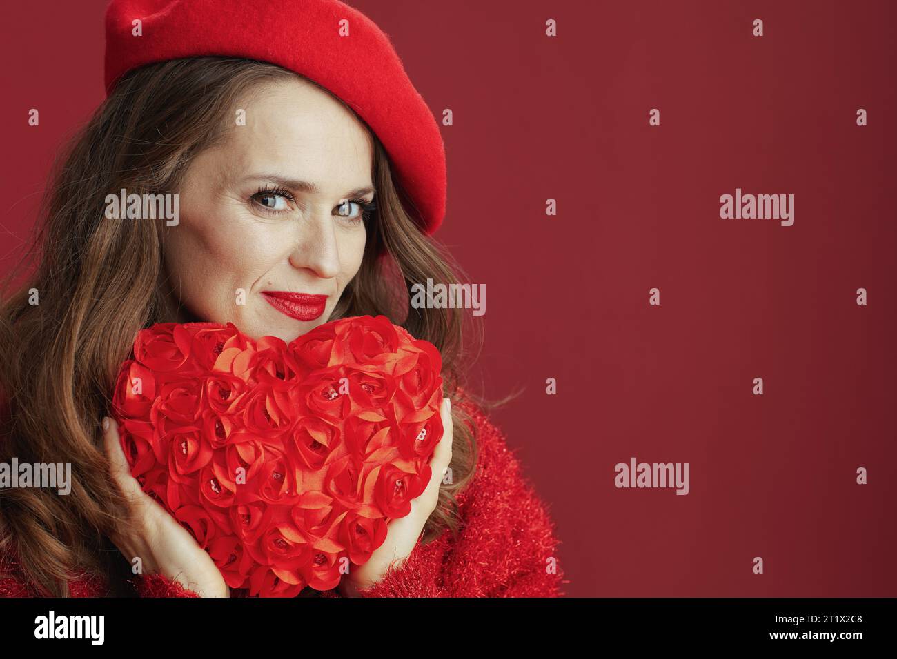 Happy Valentine. elegant 40 years old woman in red sweater and beret ...