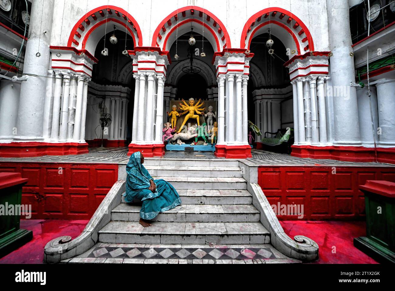 A Muslim woman wearing Saree is seen seated on the stairs of a Bonedi ...