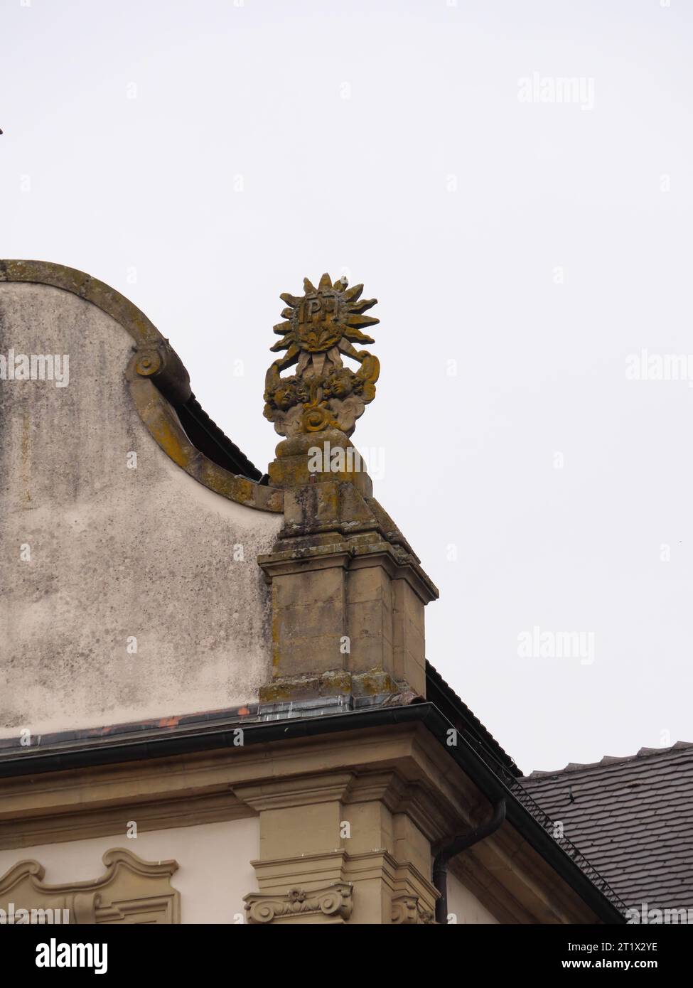 Statue on baroque stepped gable on old house in monastery Schöntal in ...