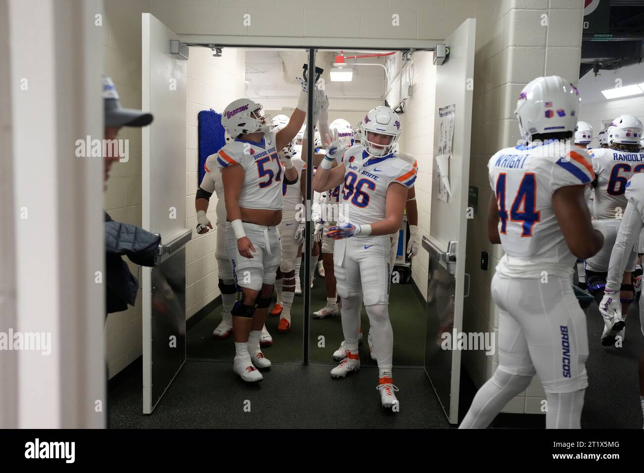 Boise State offensive lineman Nathan Cardona (57) and tight end Luke ...