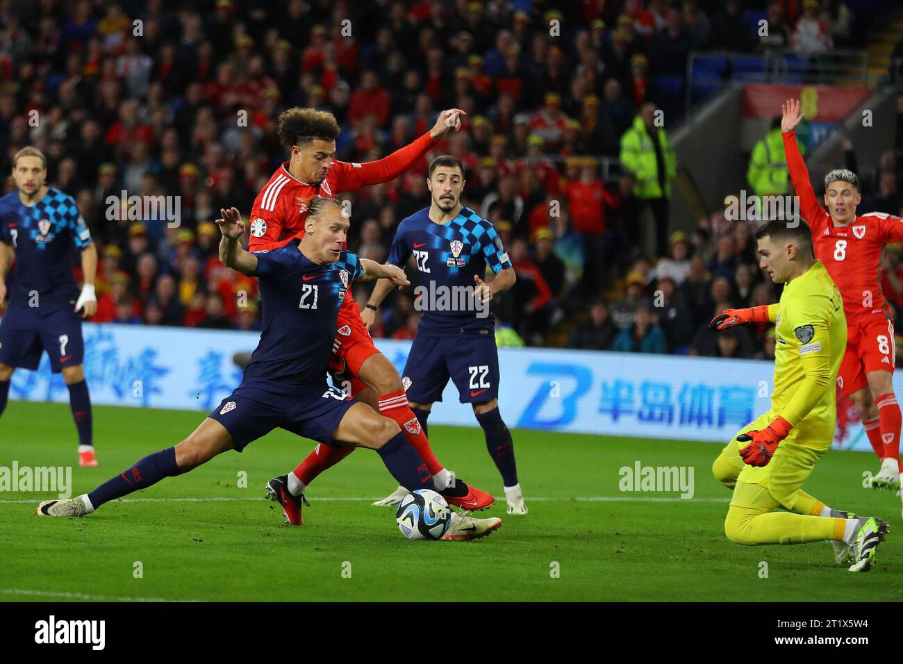Cardiff, UK. 15th Oct, 2023. Ethan Ampadu of Wales (c) and Domagoj Vida ...
